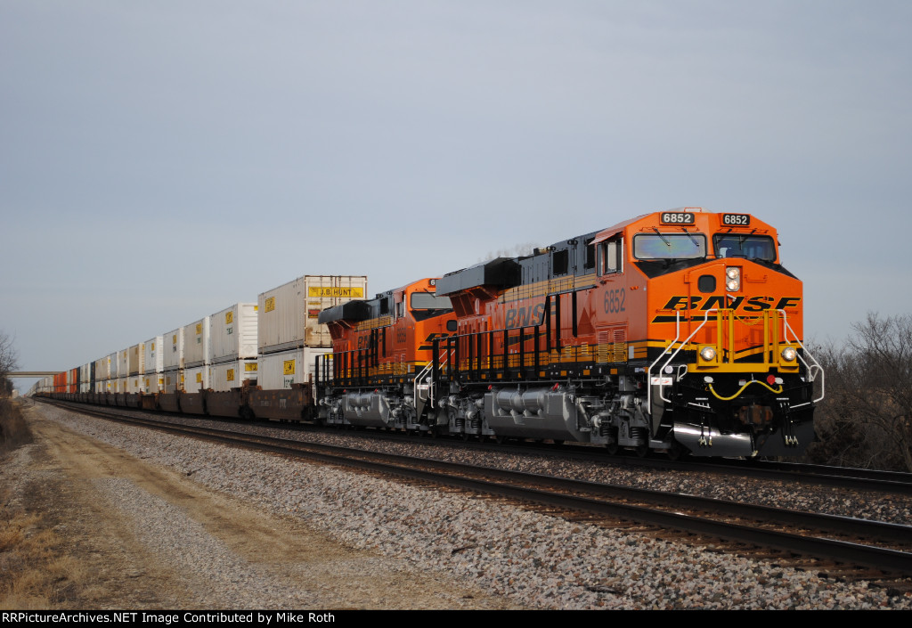 BNSF 6852 a brand spankin new ES44C4 blasts by me at Gibbs Missouri